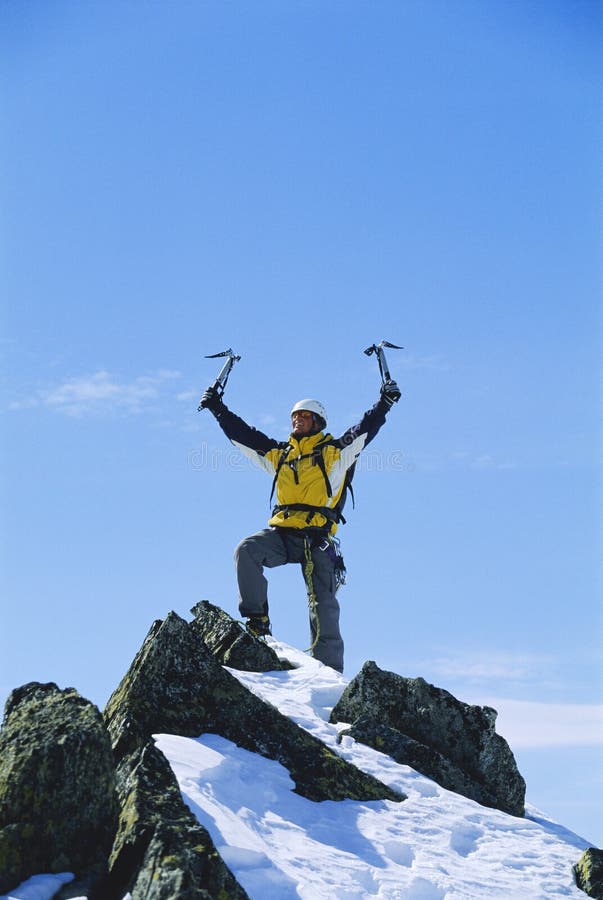 Young Man Celebrating Reaching the Top of Mountain Stock Photo - Image ...