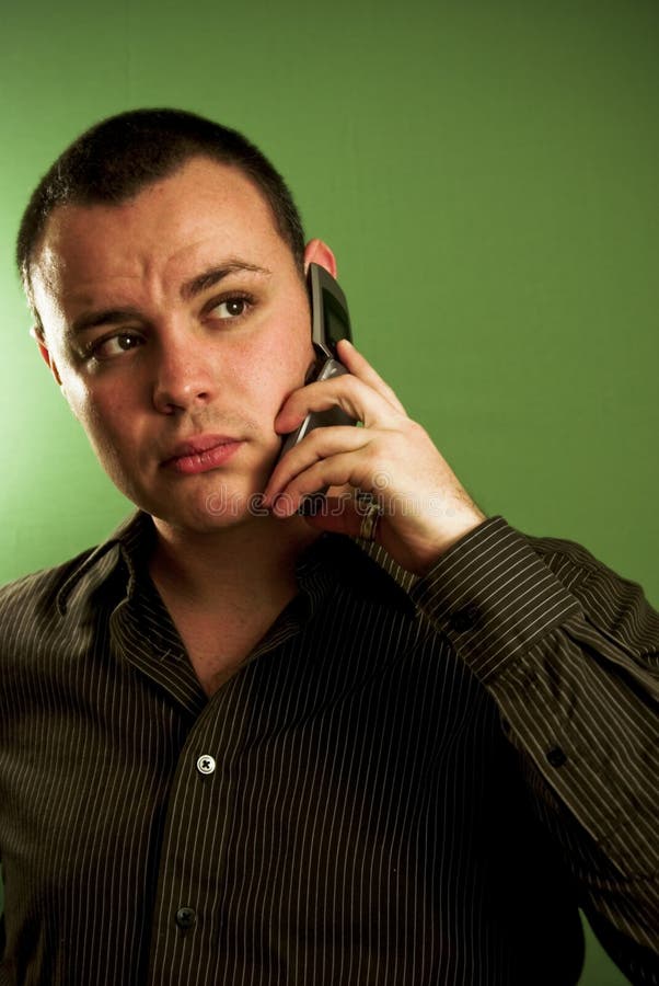 Young man on cell phone stock image. Image of electronics - 3520863