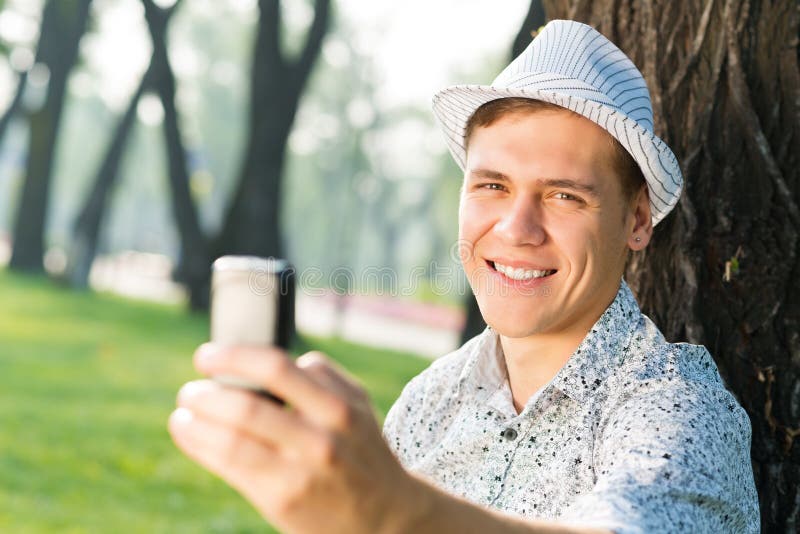 Young Man with a Cell Phone Stock Image - Image of manager, laptop ...