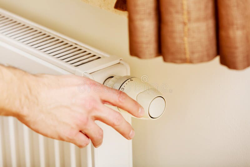 Young Man Changing Temperature of Radiator Stock Photo - Image of ...