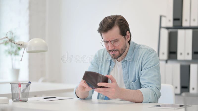 Young Man Checking Empty Wallet at Work Stock Photo - Image of finance ...