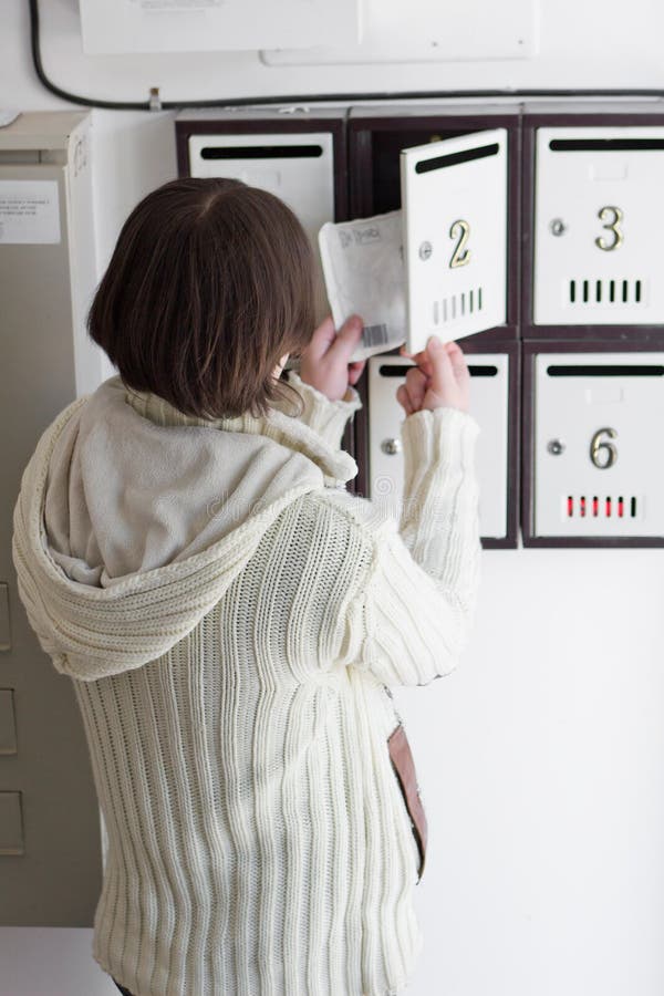 Young Man Checking Letter-box Stock Image - Image of single, posting ...