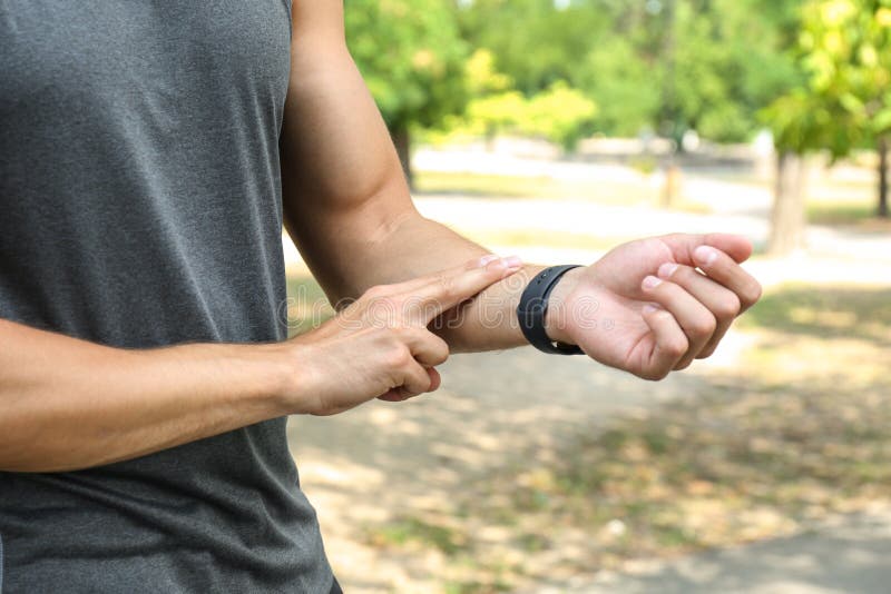 Young Man Checking Pulse After Training , Closeup Stock Image - Image ...