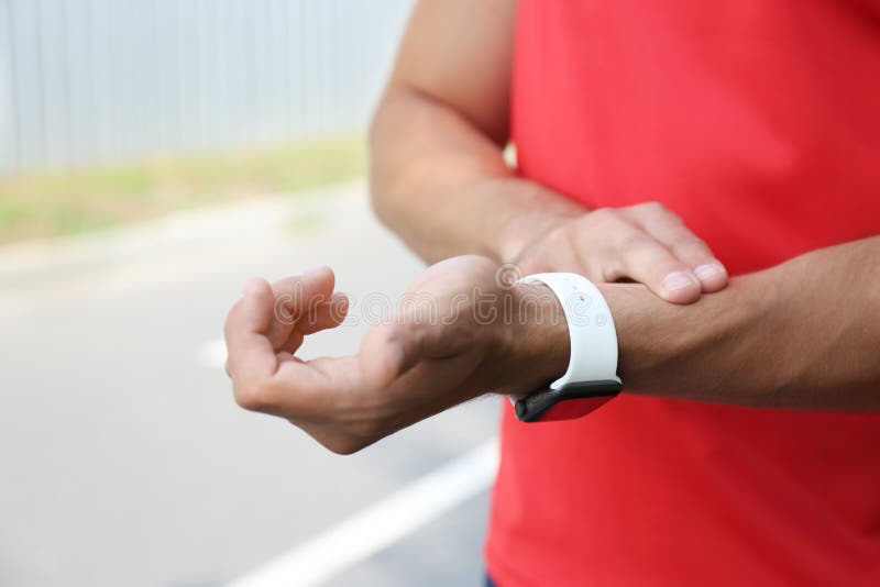Young Man Checking Pulse after Outdoors, Closeup Stock Image - Image of ...