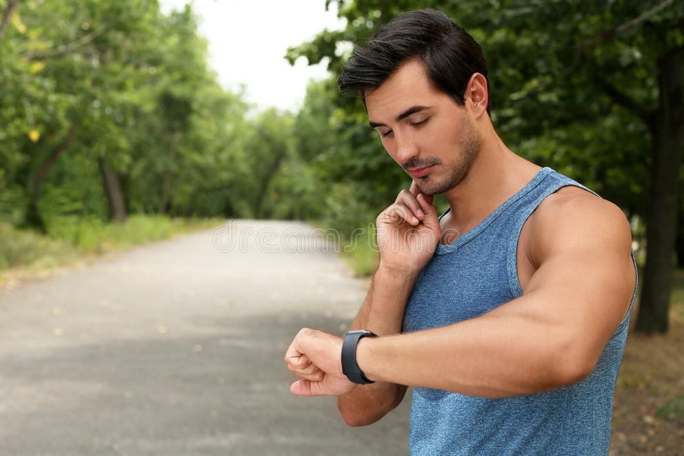 Young Man Checking Pulse after Training in Park Stock Photo - Image of ...
