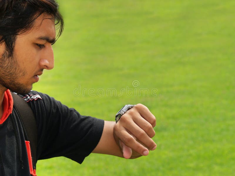 Young Man Checking the Time Stock Image - Image of model, asian: 4033631