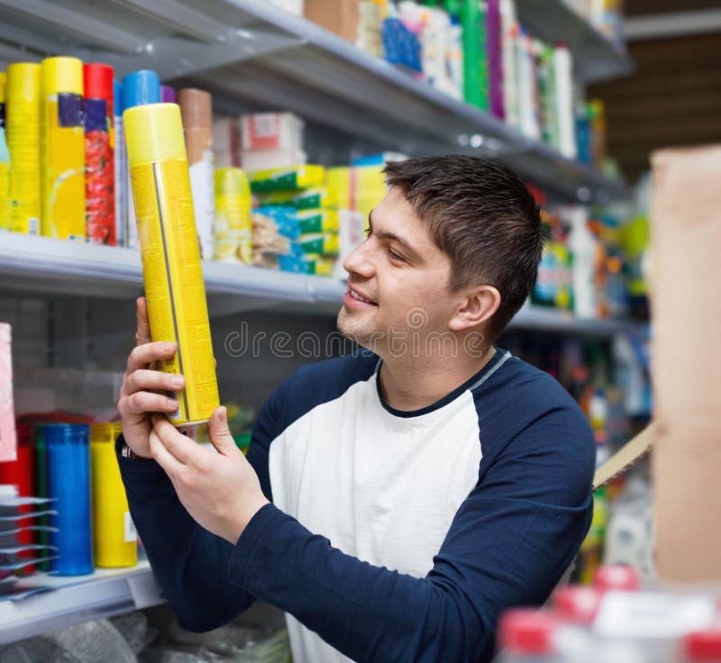 Young Man Choosing Insects Killer Spray Stock Photo - Image of ...