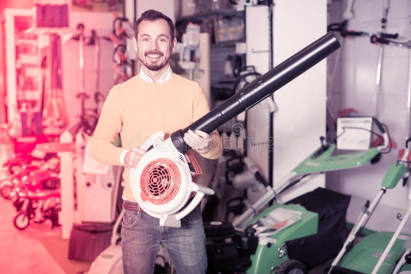 Young Man Choosing Leaf Blower Stock Image - Image of instrument ...
