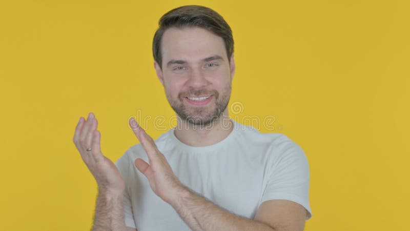 Young Man Clapping, Applauding on Yellow Background Stock Image - Image ...