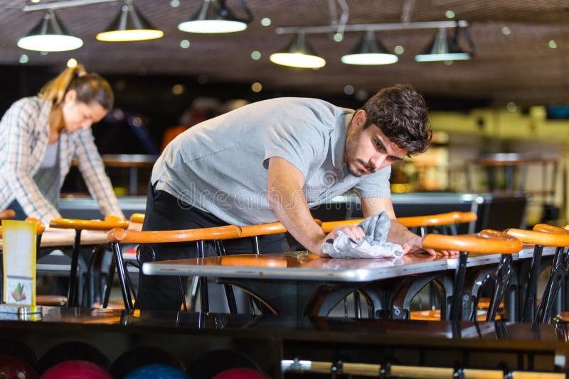 Young man cleaning cafe stock image. Image of food, people - 202443135