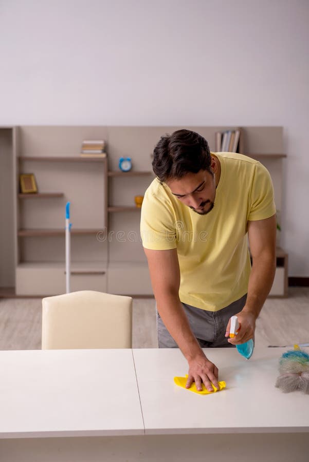 543 Man Dusting Desk Stock Photos - Free & Royalty-Free Stock Photos ...
