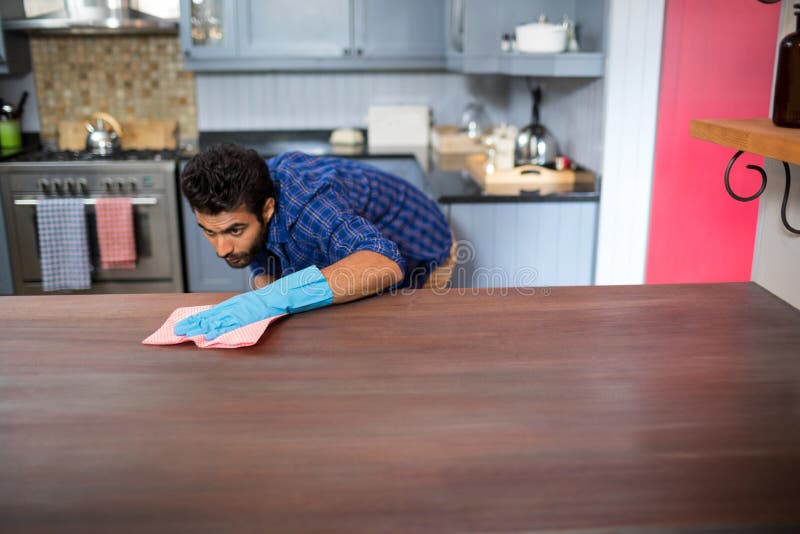 Young Man Cleaning Table with Napkin Stock Photo - Image of interior ...