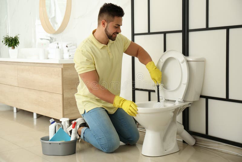 Young Man Cleaning Toilet Bowl Stock Photo - Image of male, clean ...