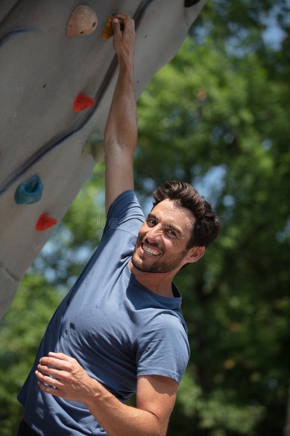 Young Man Climbing Practise Wall in Nature Stock Photo - Image of ...