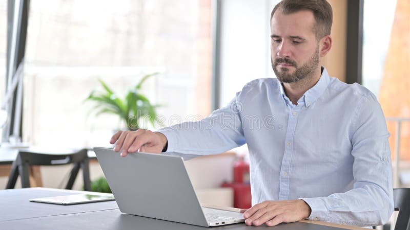 Young Man Closing Laptop after Work Stock Image - Image of sitting ...