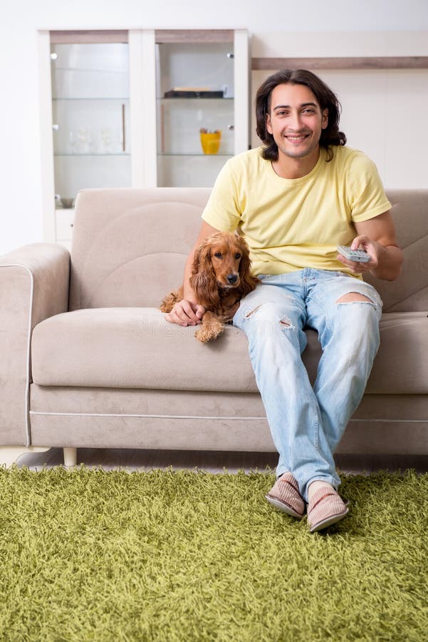 Young Man with Cocker Spaniel Dog Stock Image - Image of alone, hugging ...