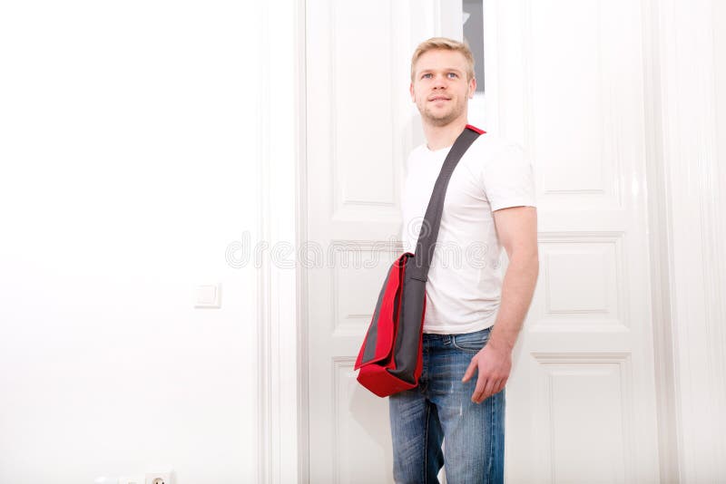 Young man coming home stock photo. Image of entrance - 41215704
