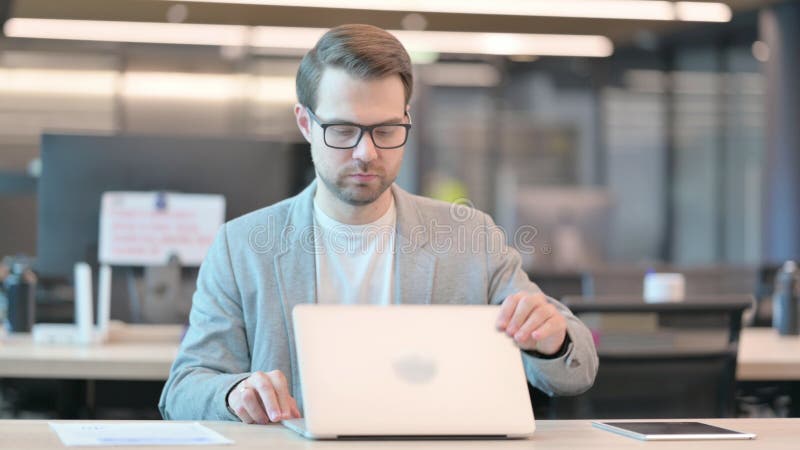 Young Man Coming in Office, OPening Laptop Stock Image - Image of start ...