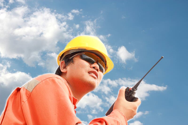 Man in Hard Hat Using Walkie Talkie Stock Photo - Image of industry ...