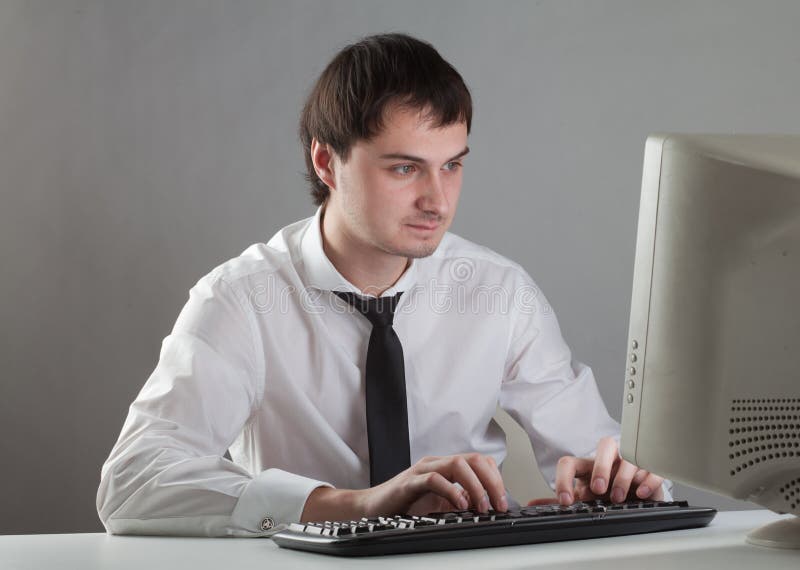 Man in Front of Computer Screen Stock Image - Image of serious, young ...