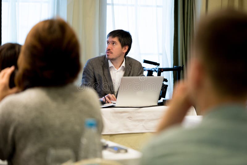 Young Man at Conference with Camera Stock Image - Image of computer ...