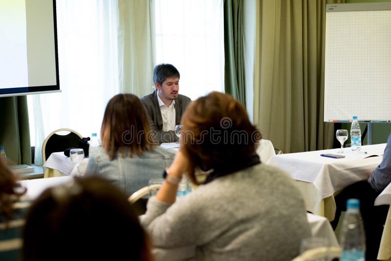 Young man at conference stock image. Image of talk, business - 114460259