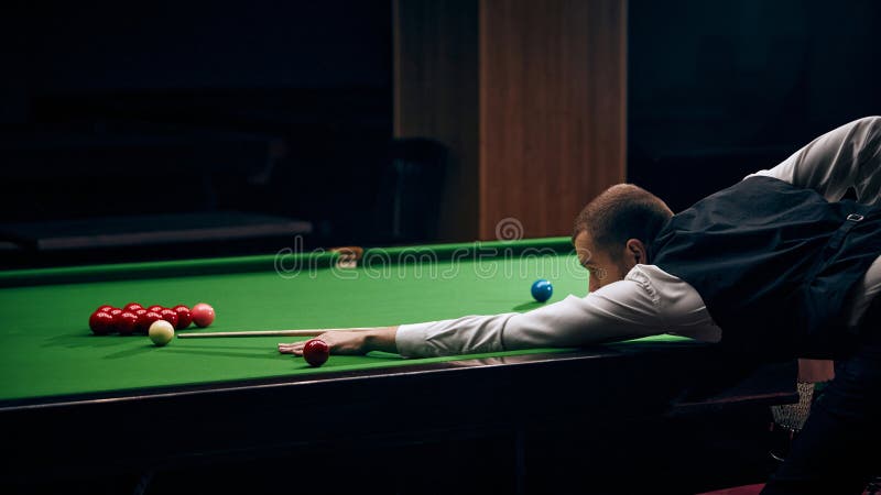 Young Man Confidently Studying Angles of Billiards Table, Playing ...