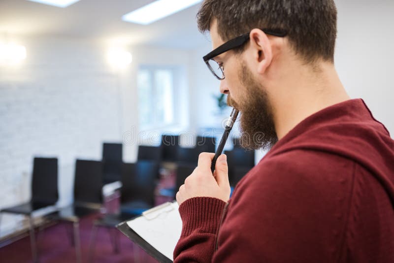 Young Man Considering and Making Notes Stock Photo - Image of casual ...