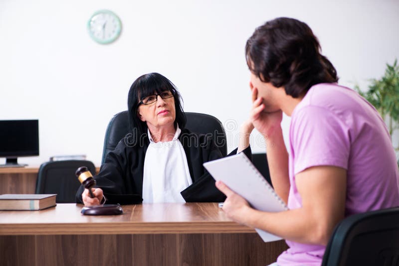 Young Man Consulting with Judge on Litigation Issue Stock Photo - Image ...