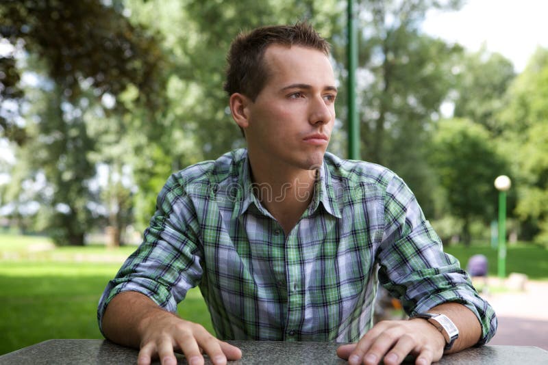 Young man contemplating stock photo. Image of front, serious - 53698266