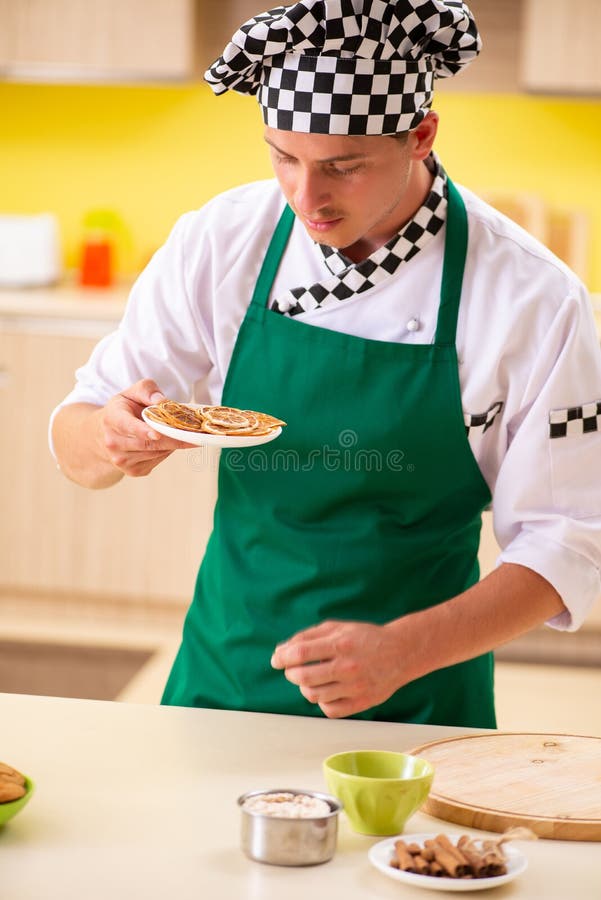 The Young Man Cook Preparing Cake in Kitchen at Home Stock Image ...