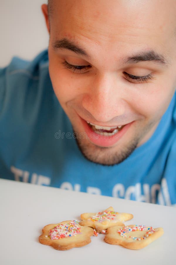 Young man with cookies stock image. Image of chinees - 17339253