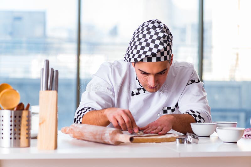 The Young Man Cooking Cookies in Kitchen Stock Photo - Image of chef ...