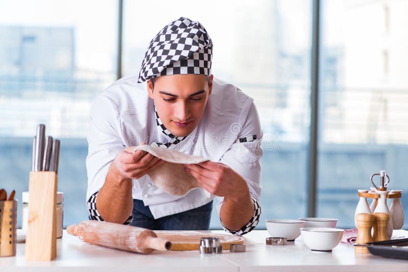 The Young Man Cooking Cookies in Kitchen Stock Photo - Image of baker ...