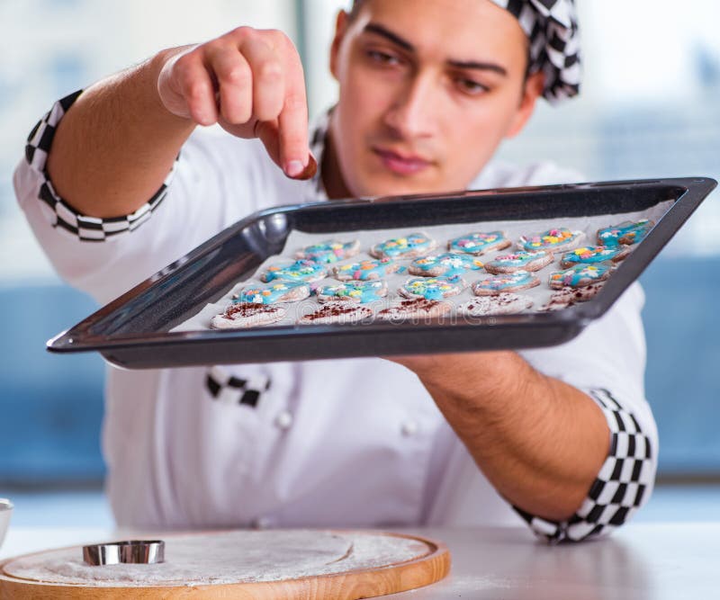 Young Man Cooking Cookies in Kitchen Stock Photo - Image of holding ...