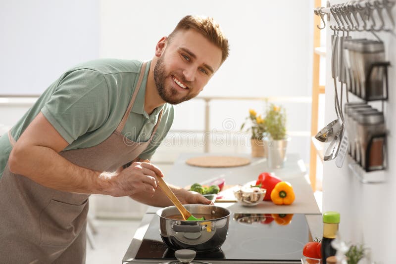 Young Man Cooking Delicious Soup Stock Image - Image of dish, broth ...