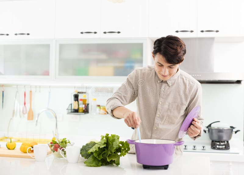 Man Cooking at Home in Kitchen Stock Image - Image of house, male ...
