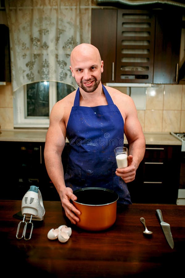 A Young Man is Cooking in a Large Kitchen Stock Photo - Image of happy ...
