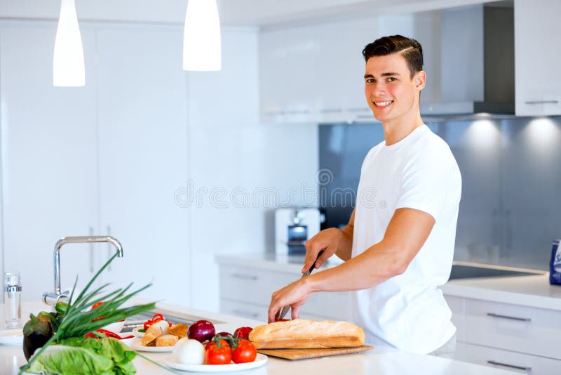 Young man cooking stock image. Image of dinner, cooking - 106804213