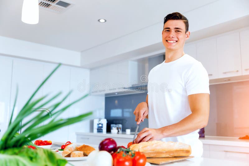 Young man cooking stock image. Image of caucasian, healthy - 134736367