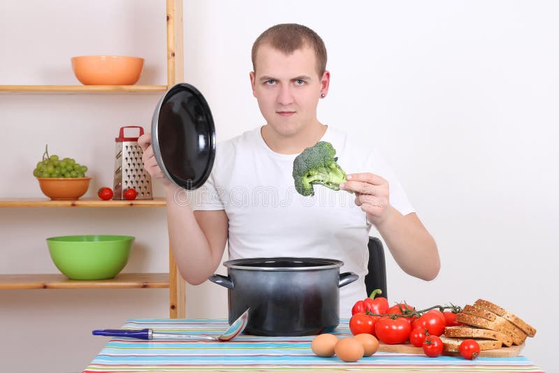 Young Man Cooking Soup in the Kitchen Stock Photo - Image of bread ...