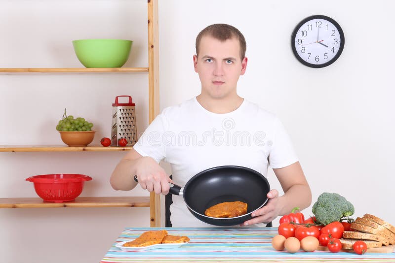 Young Man Cooking Steek in the Kitchen Stock Image - Image of grill ...