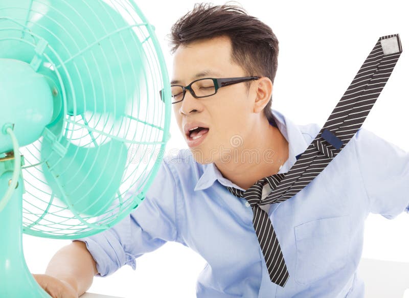 Young Man Cooling Face Under Wind of Fan Stock Photo - Image of asian ...