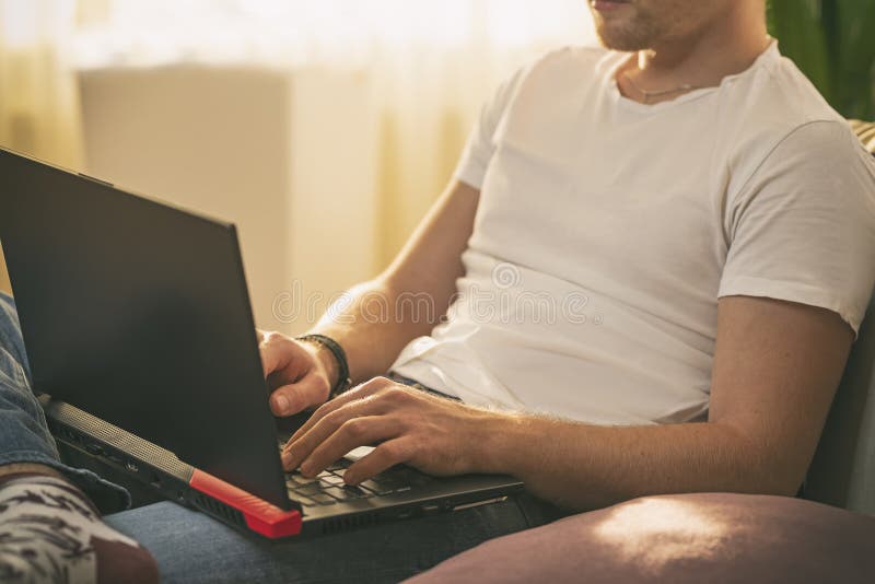 Young Man on the Couch with a Laptop. Work, Study Stock Image - Image ...