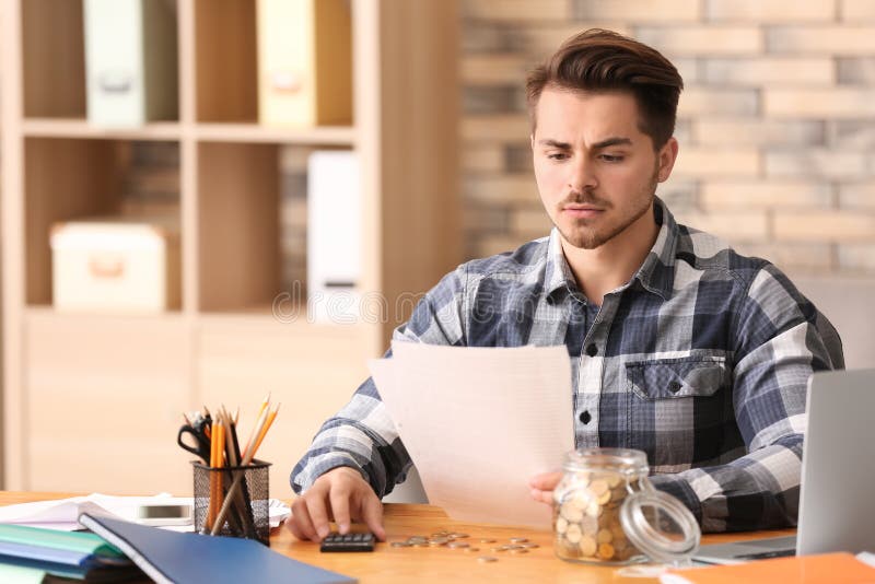 Young Man Counting Money at Table Indoors Stock Image - Image of ...