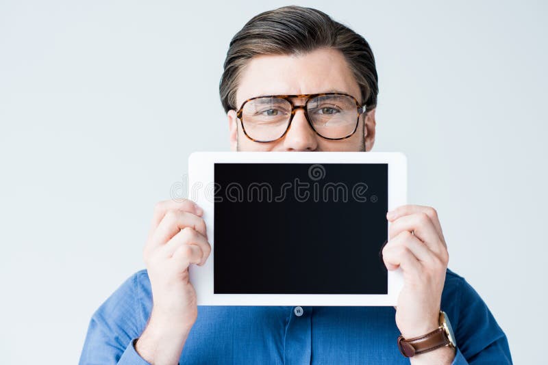 Young Man Covering Half of Face with Tablet with Blank Screen Stock ...