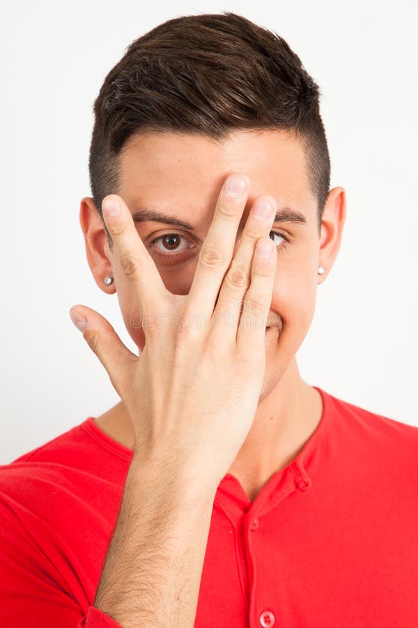 Young man covering one eye stock image. Image of male - 31733433
