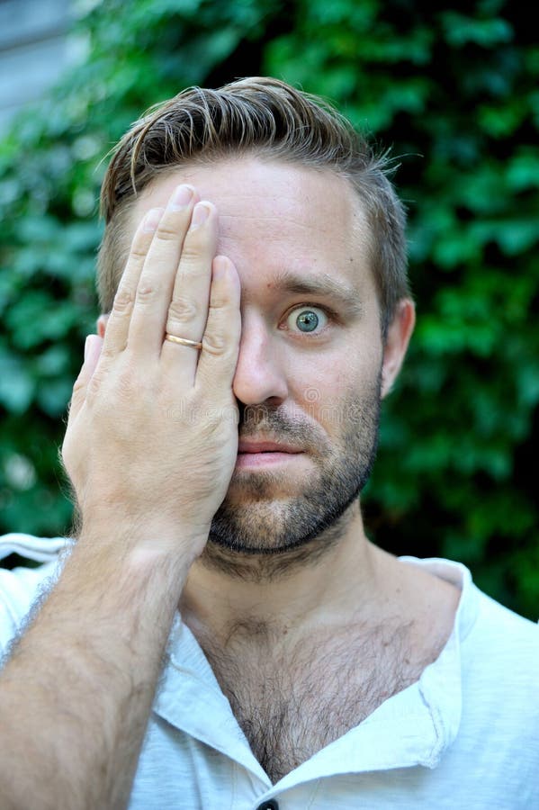 Young Man Covers Half His Face by Hand Stock Image - Image of ...
