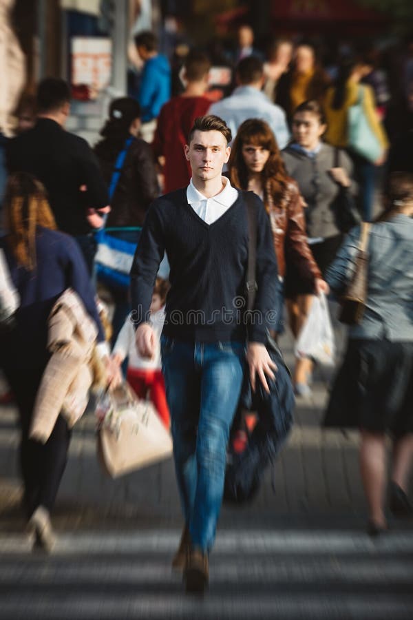 Young man cross the street editorial stock image. Image of white - 46805534