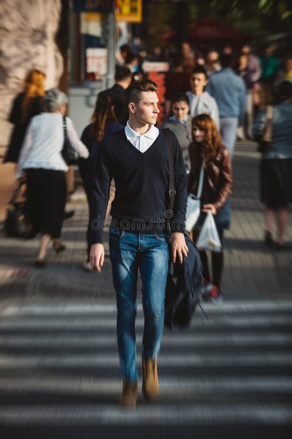 Young man cross the street stock image. Image of white - 46805605